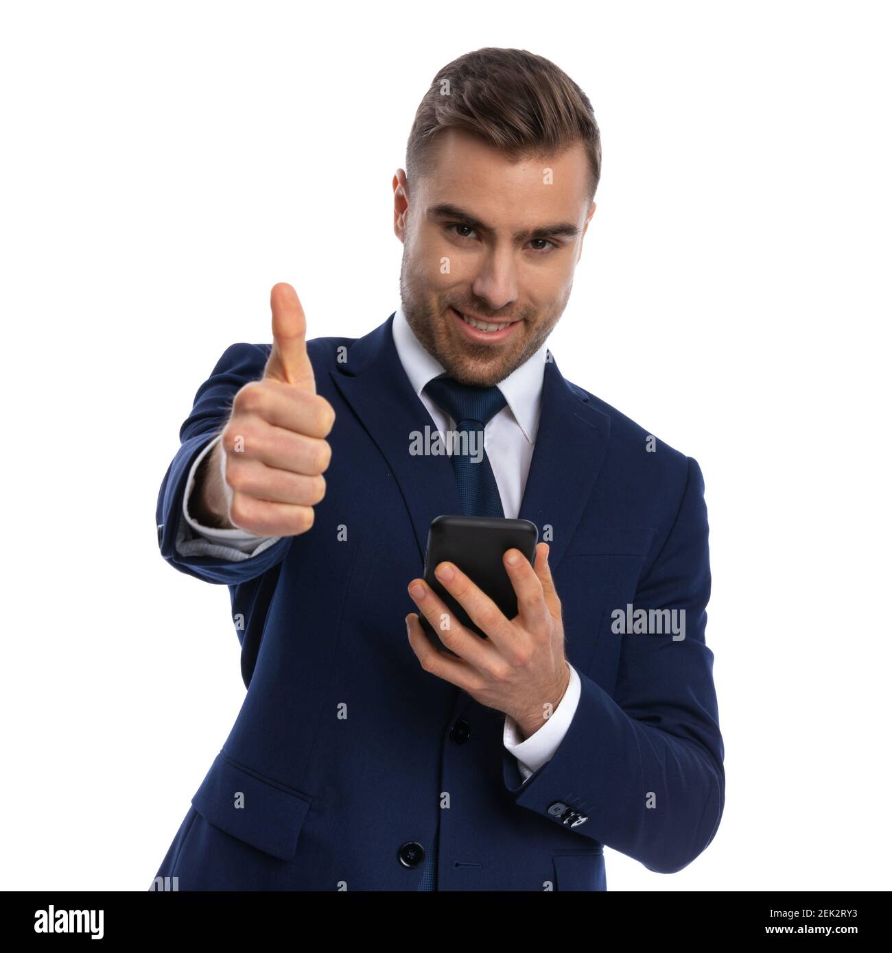 handsome bearded man in navy blue suit standing on white background ...