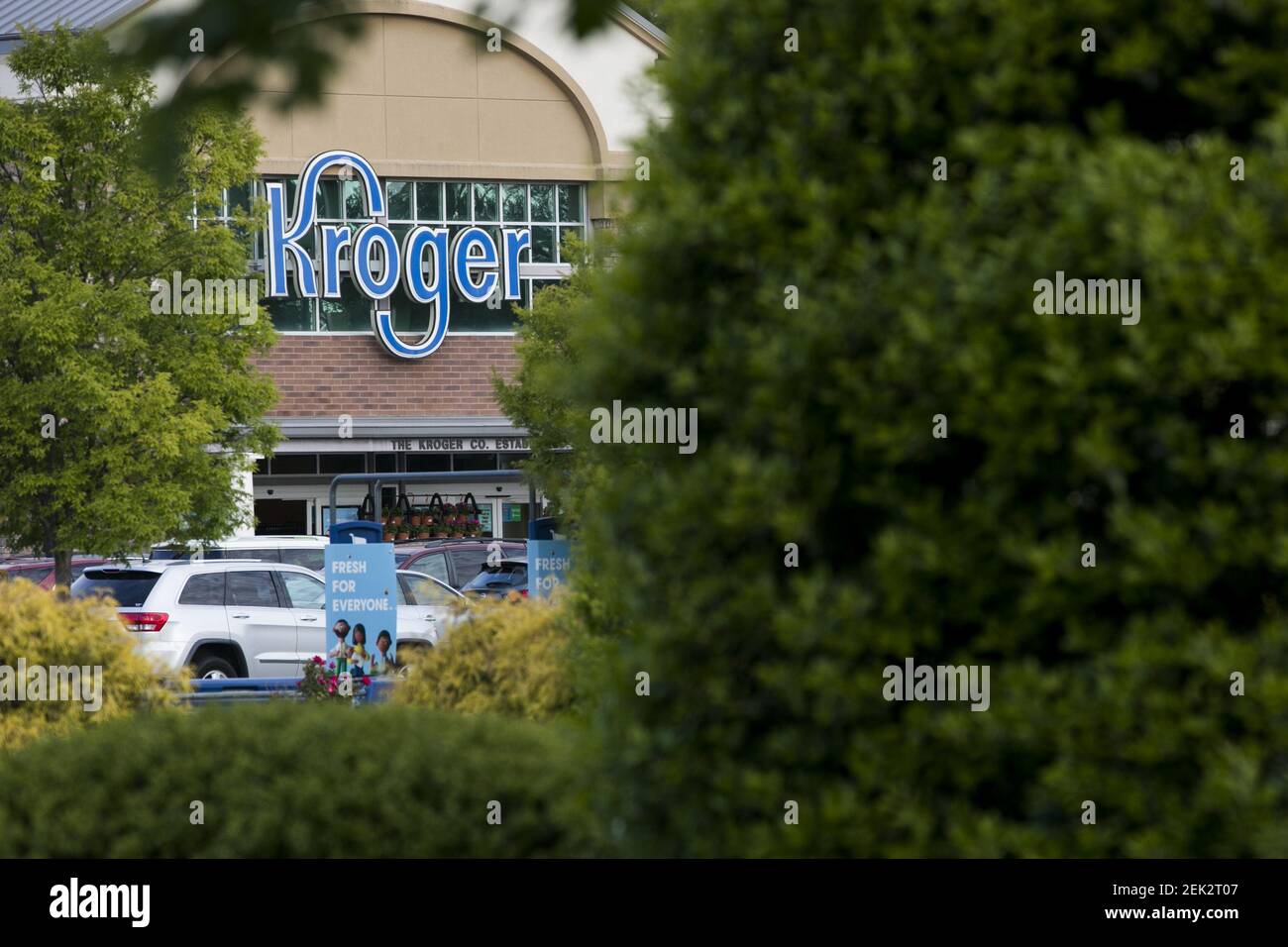 A logo sign outside of a Kroger retail grocery store location in ...