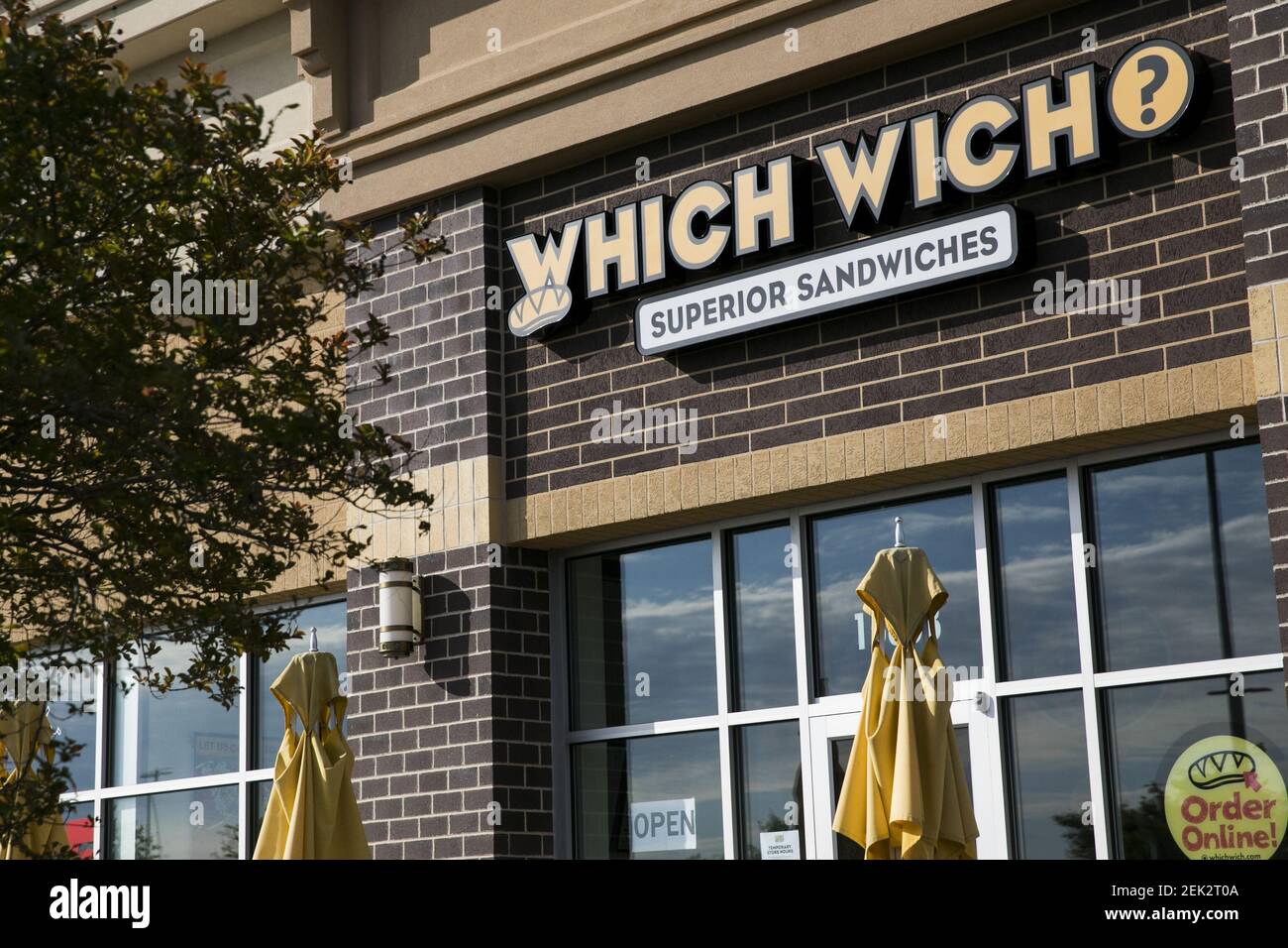A logo sign outside of a Which Wich Superior Sandwiches restaurant ...