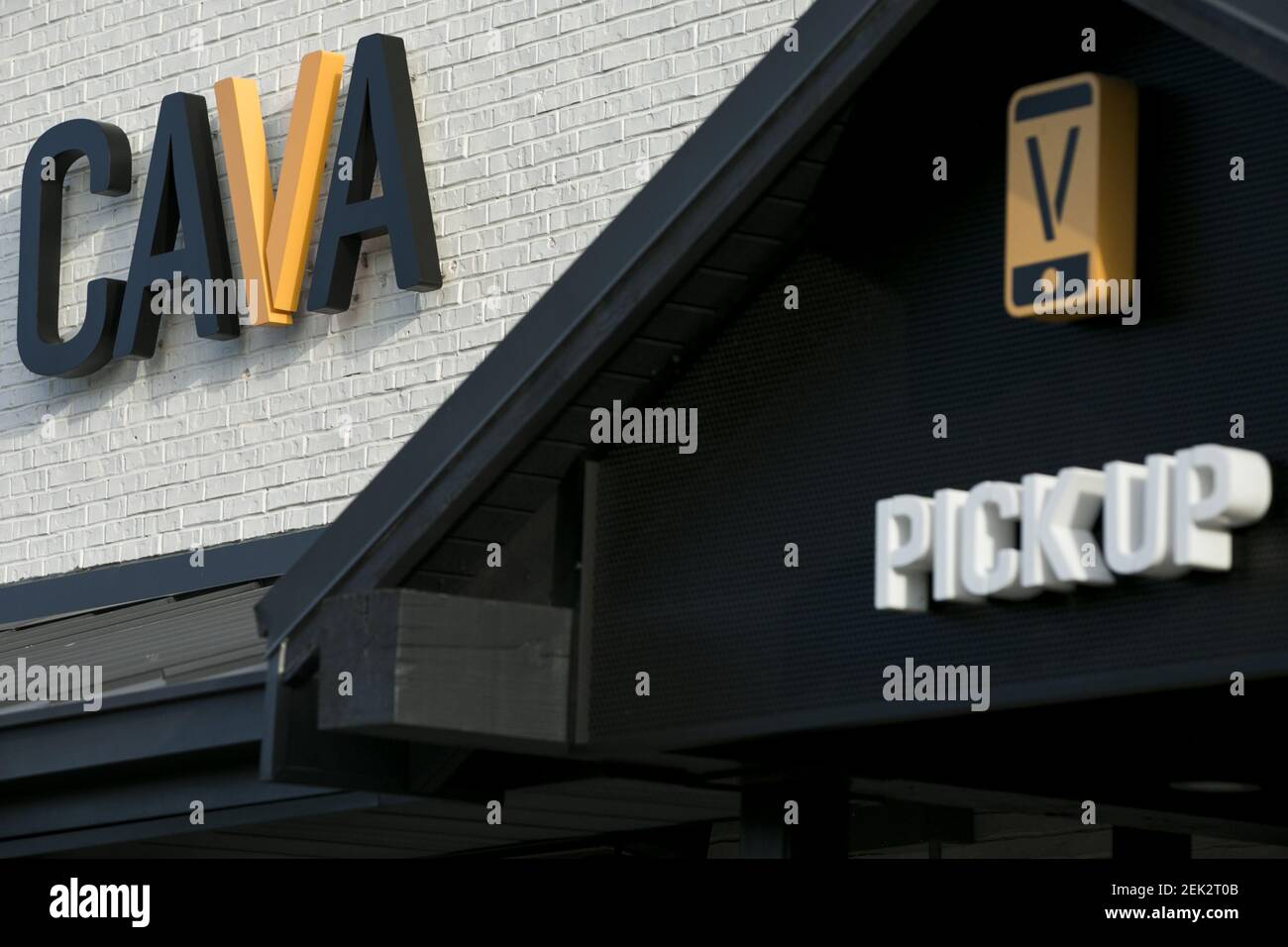 A logo sign outside of a Cava restaurant location in Richmond, Virginia ...