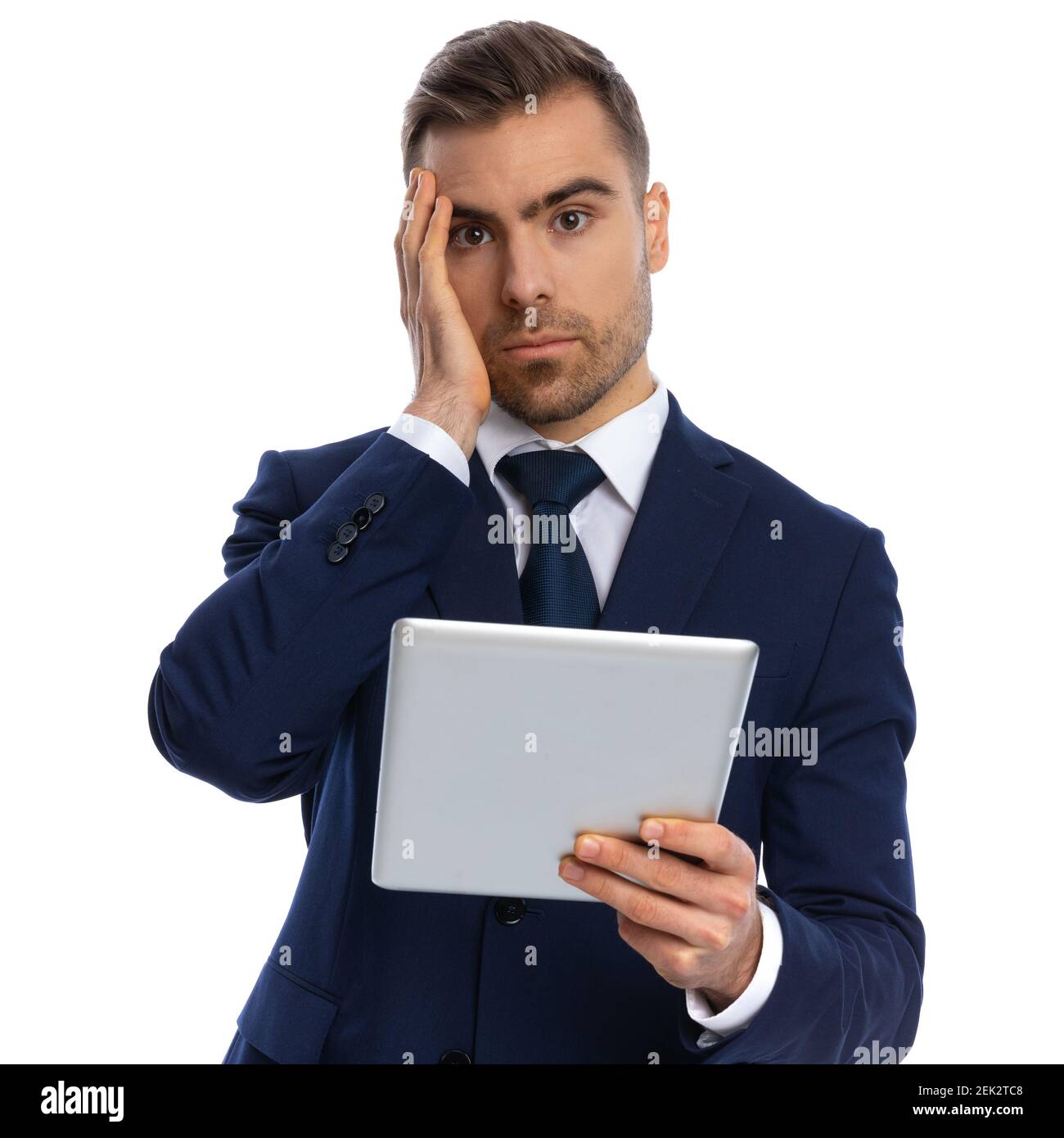 disappointed young businessman in navy blue suit making upset face ...