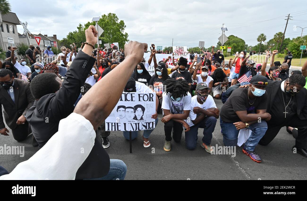 Hundreds march in downtown Brunswick, Ga., after a rally outside the ...