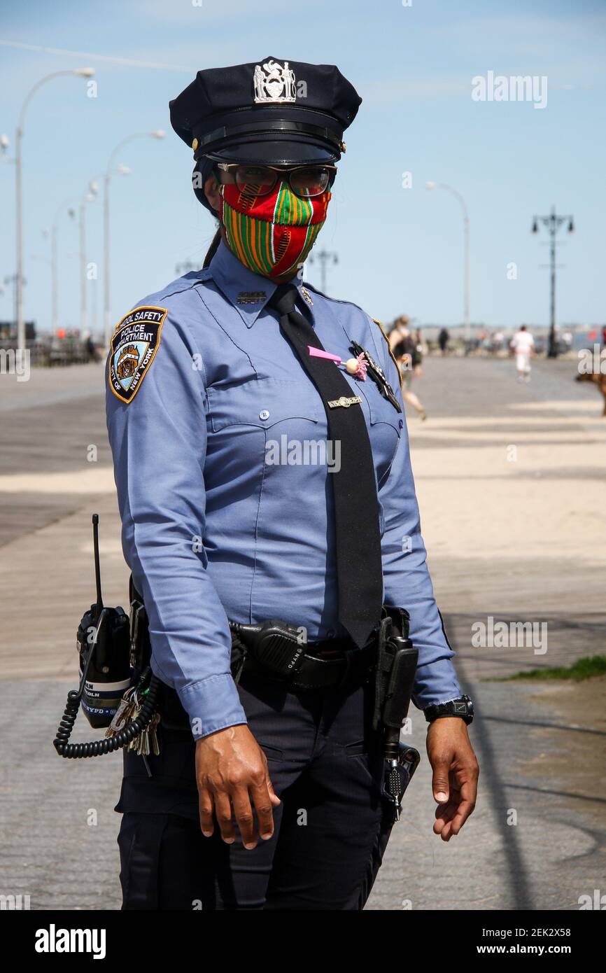 An NYPD school safety officer wears a protective mask at the Riegelmann ...
