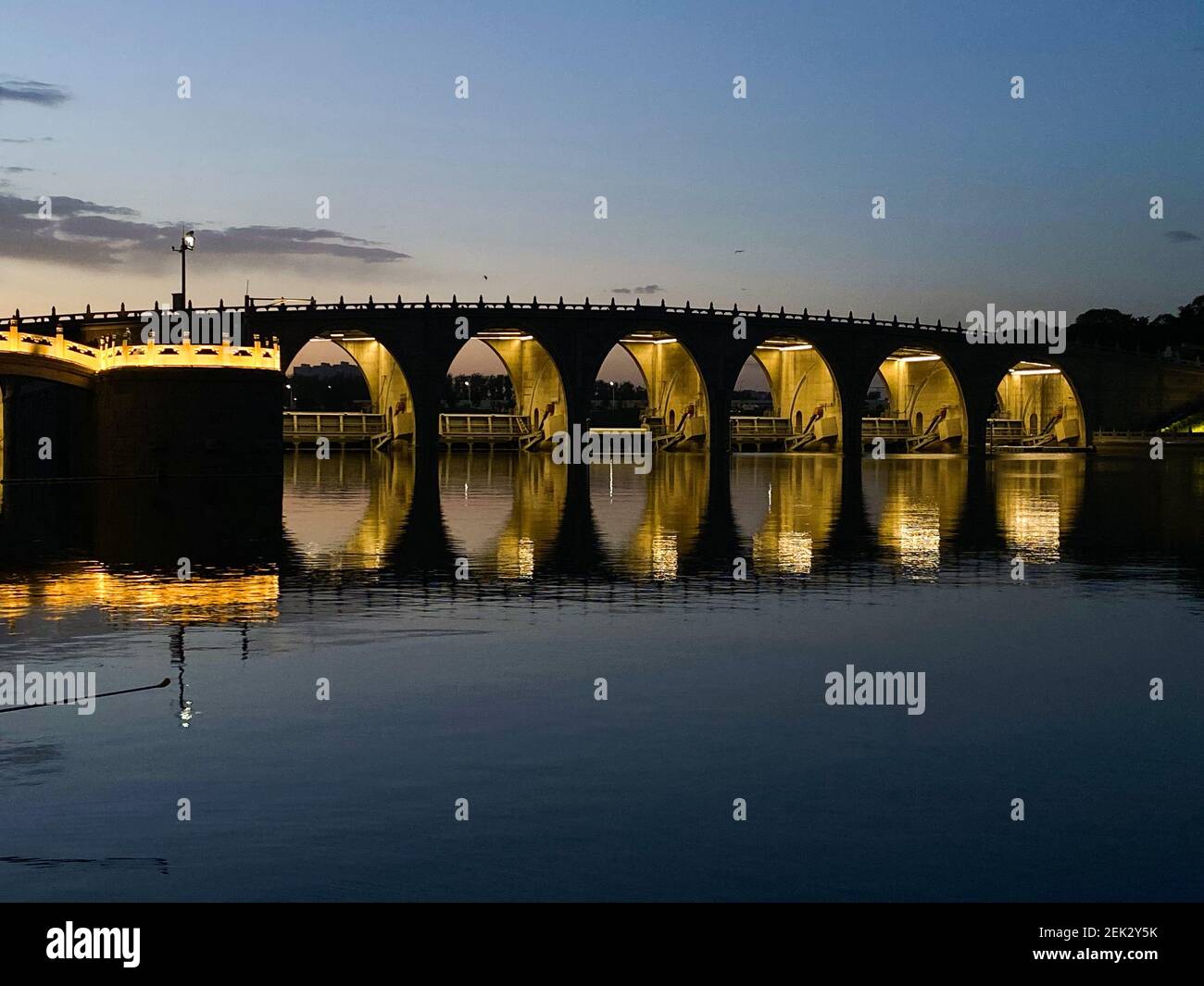 The bridge apertures are lightened up with the lights at night in ...