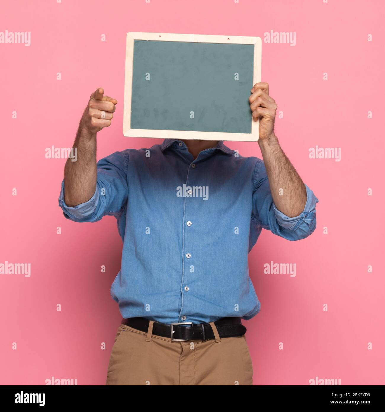 Hiding face behind fingers hi-res stock photography and images - Alamy