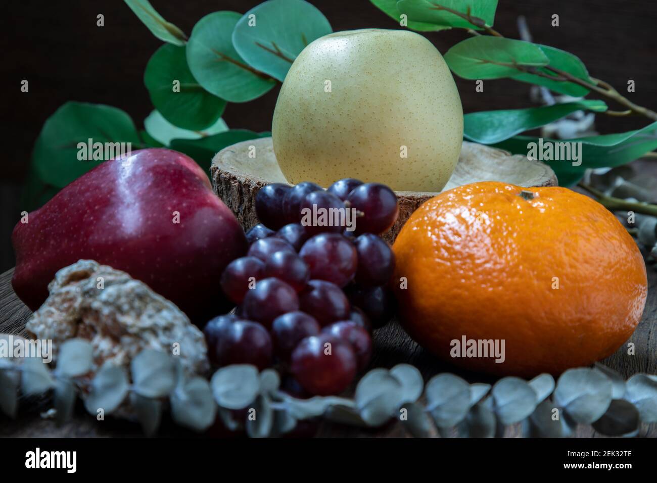 Variety of fresh assorted fruits on the old wooden table. Assorted ...