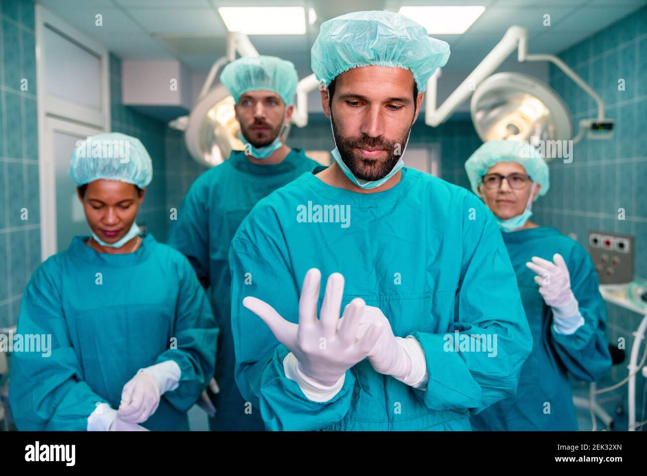 Portrait of a successful medical surgeon team inside operating room ...