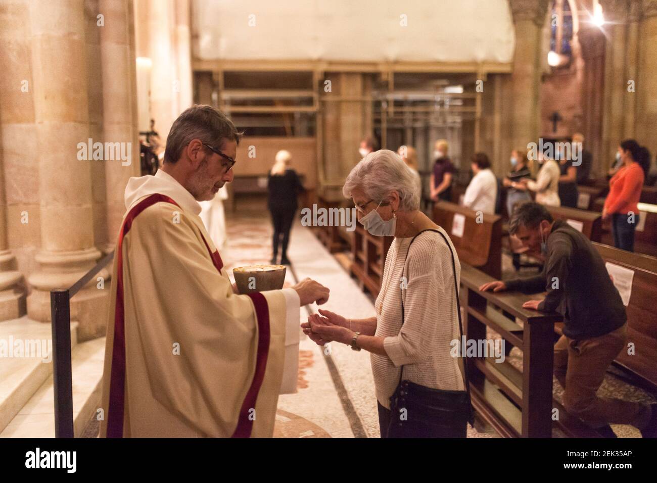 A believer seen taking the body of Christ on the first day after ...