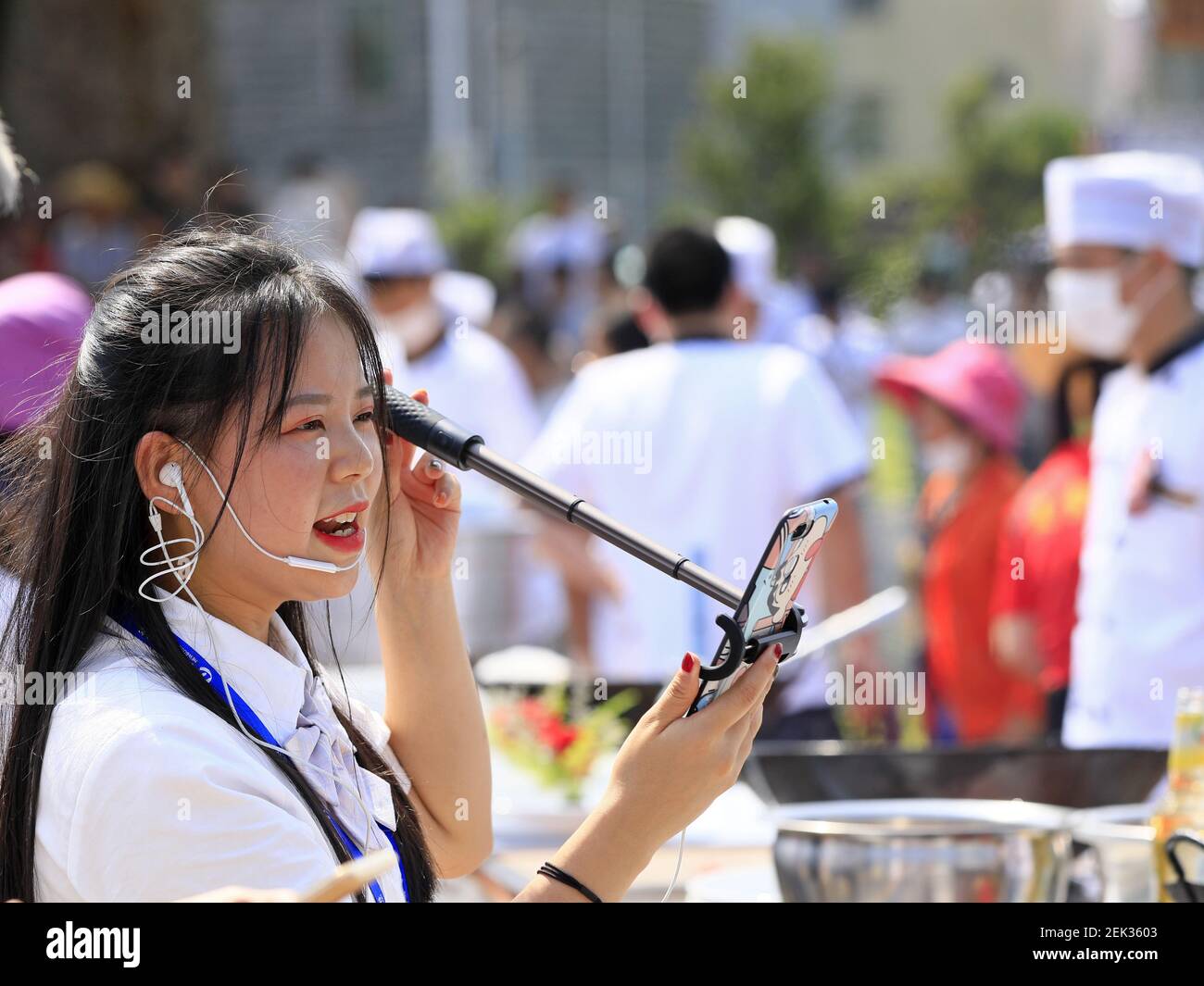 People live-stream showing the crayfish dishes presented at the Second Crayfish Festival in Ji ...