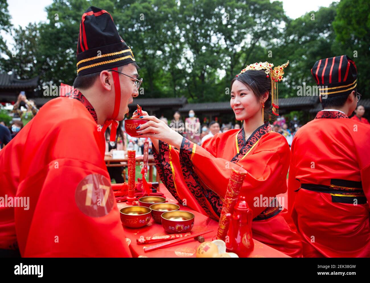 20 couples attend in a group wedding in the theme of traditional ...