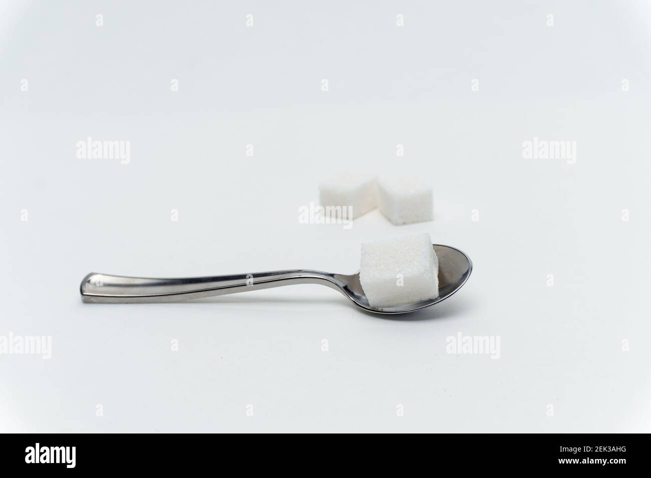 sugar cubes per teaspoon calories sweets light background Stock Photo ...