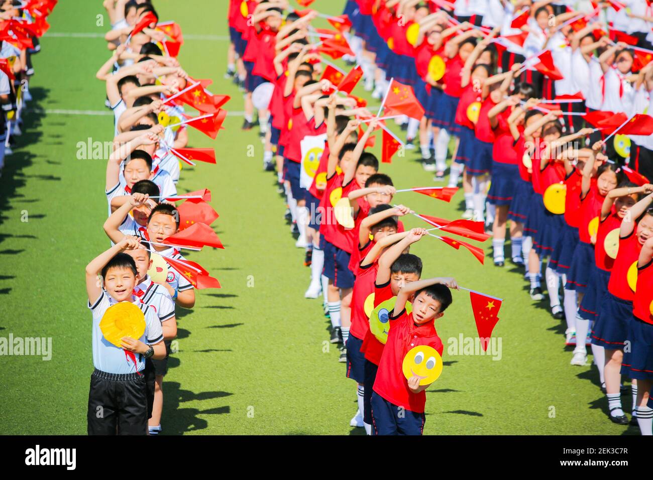 RUGAO, CHINA - MAY 22, 2020 - Primary school students wave the national ...