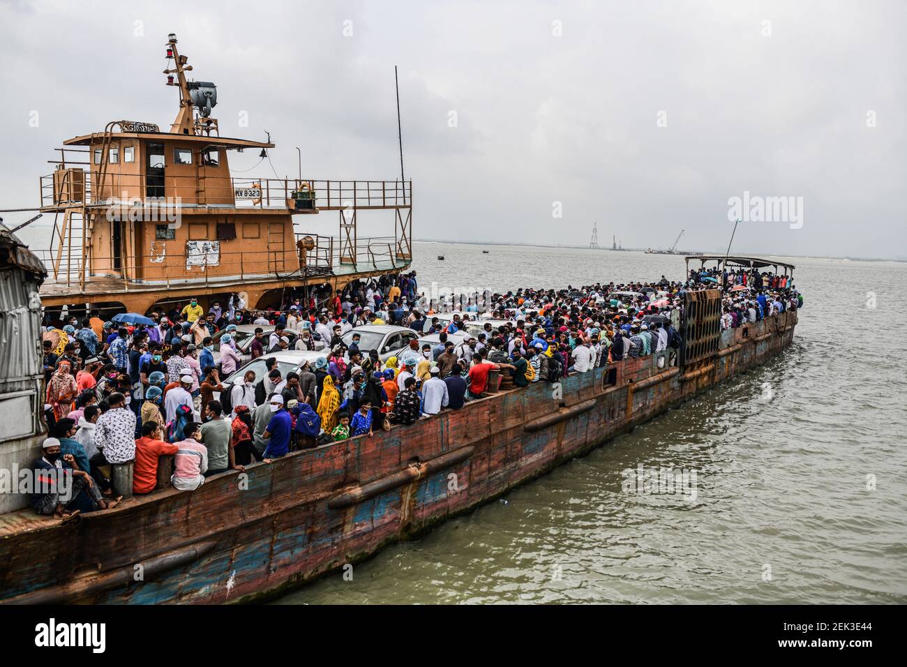 An overview of an extremely crowded ferry during eid al-fitr. Migrant ...