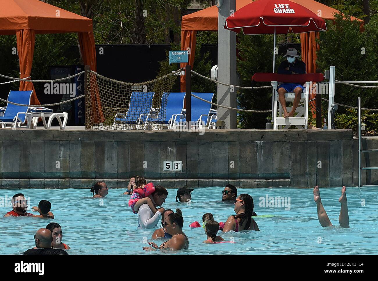 People enjoy the wave pool at Island H2O Live! water park as the ...