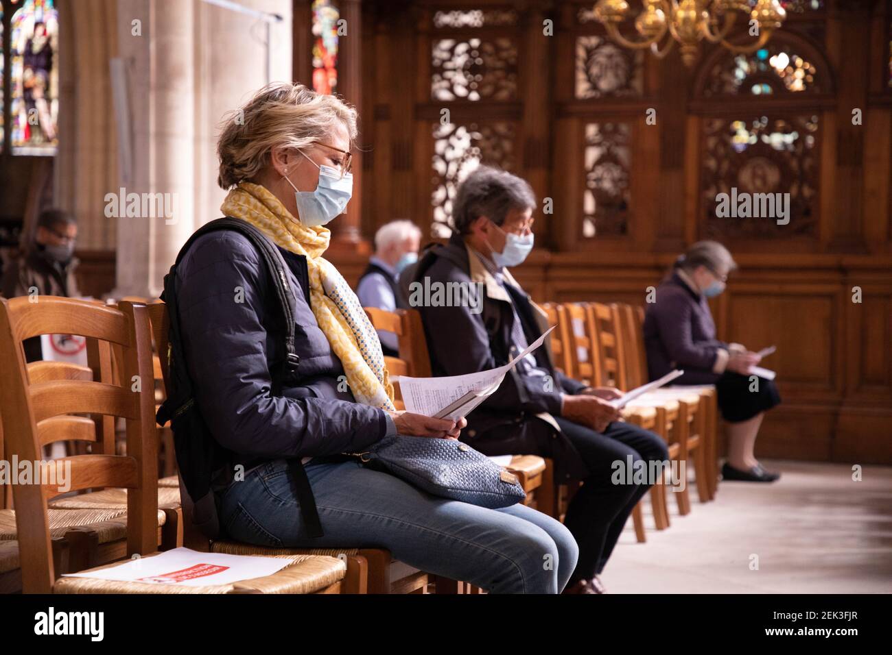 Catholics are seen wearing facemasks and observing social distance ...