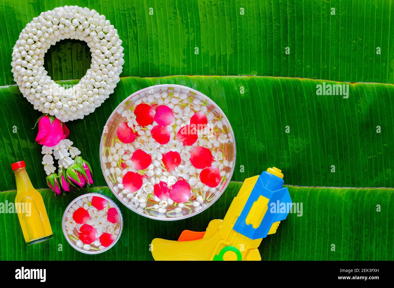 Songkran festival background with jasmine garland, flowers in water ...