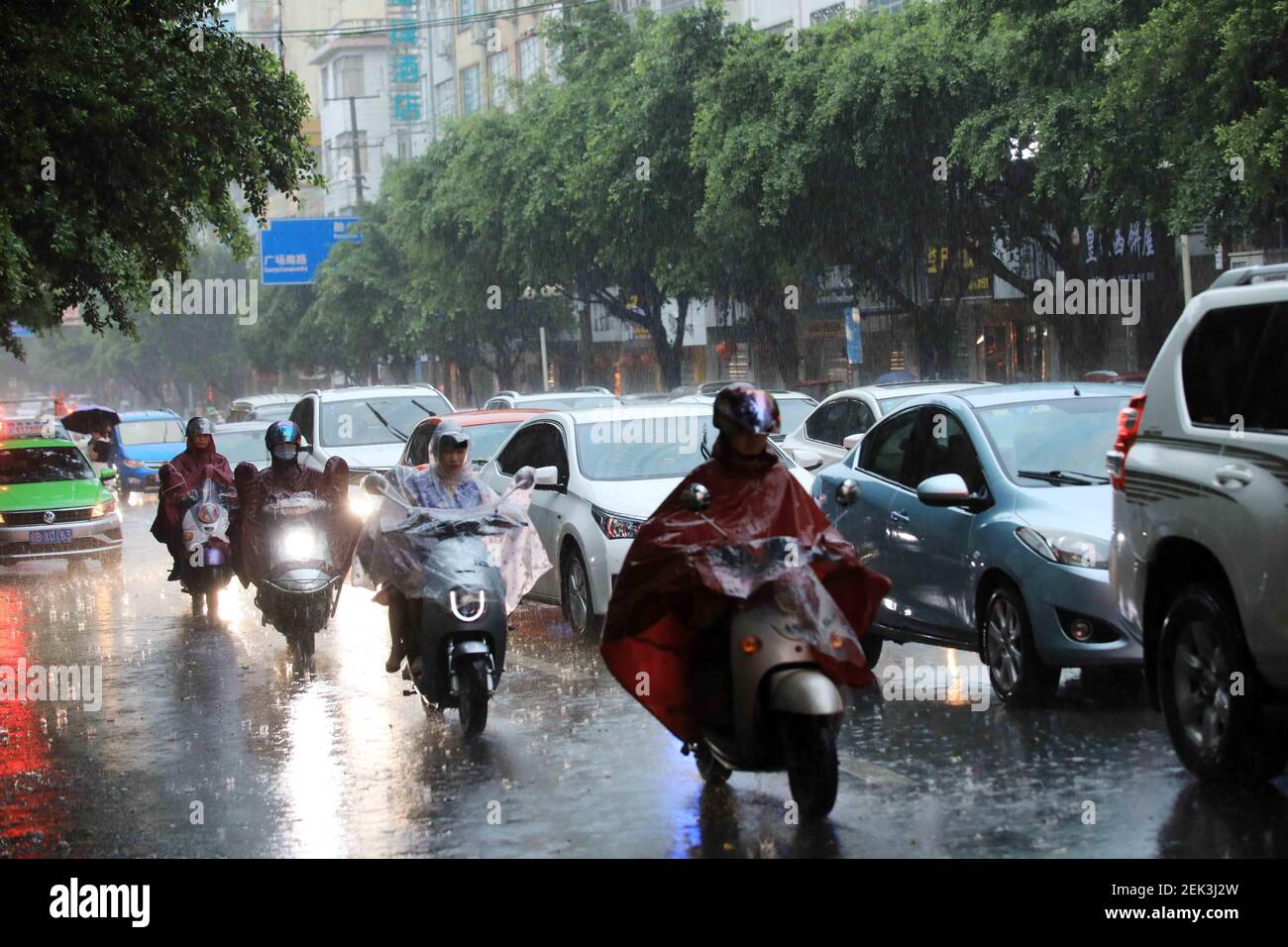 RONGAN, CHINA - MAY 25, 2020 - Citizens drive in the rain. Rongan ...