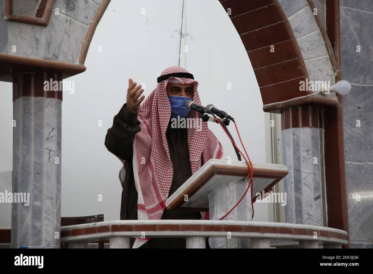 The Imam preaches while wearing a face mask as a precaution against ...