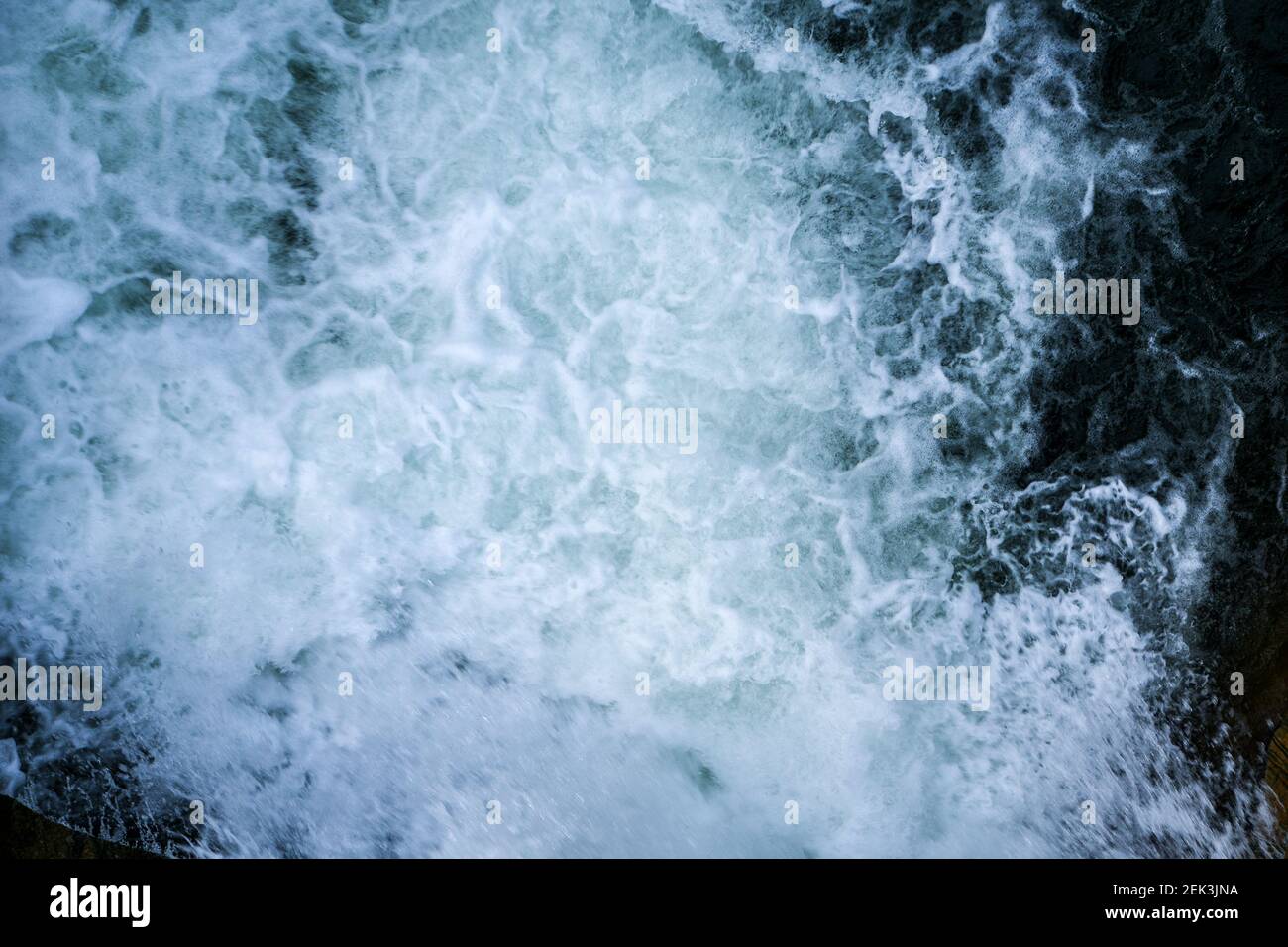 Beautiful foamy sea. Water flowing from the open sluice gates of dam ...