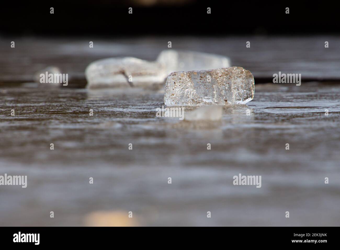 Side view of ice block laying on ice surface, selective focus Stock ...
