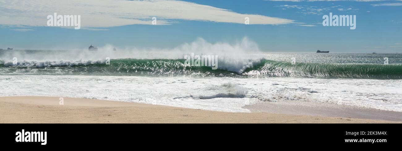 Blue wave on the beach. Blur background and sunlight spots. Dramatic ...