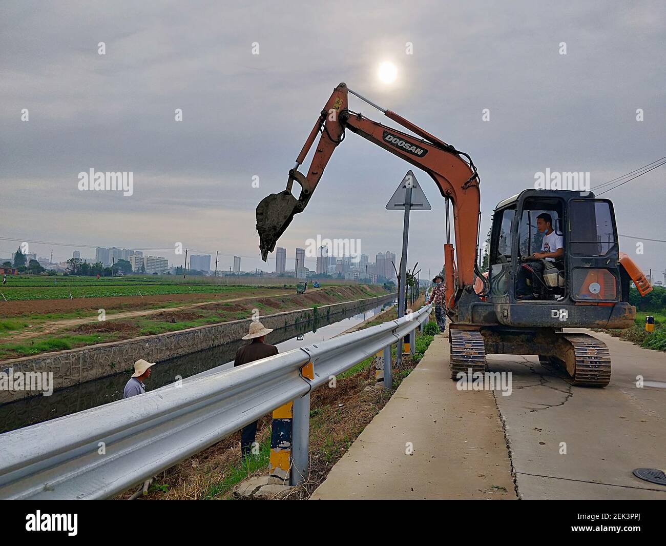 Hubeiï¼ŒCHINA-Workers plant trees near the xiwang section of chengguan ...