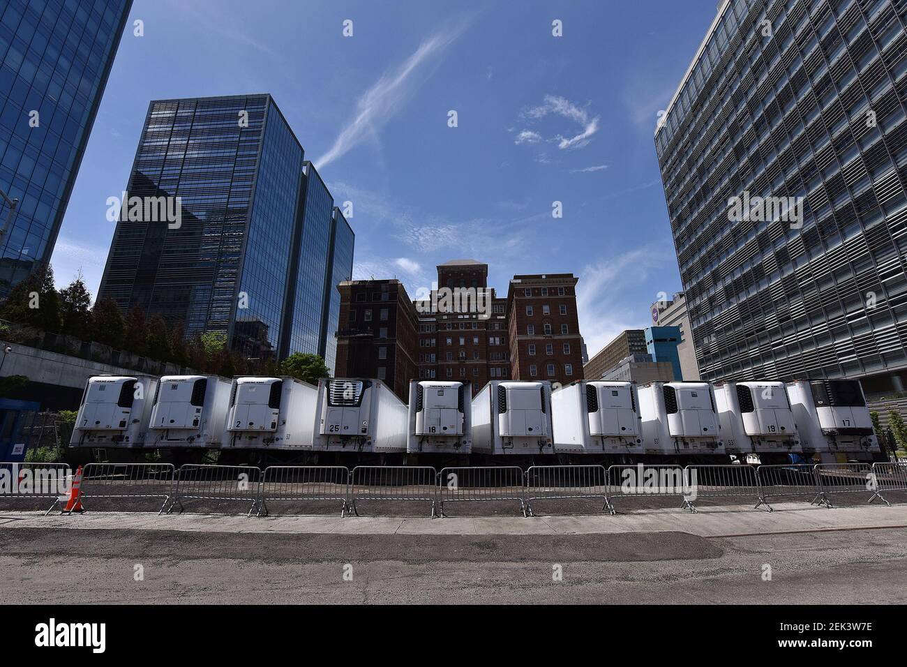 Refrigerator trucks stand outside the makeshift morgue near NYU Langone ...