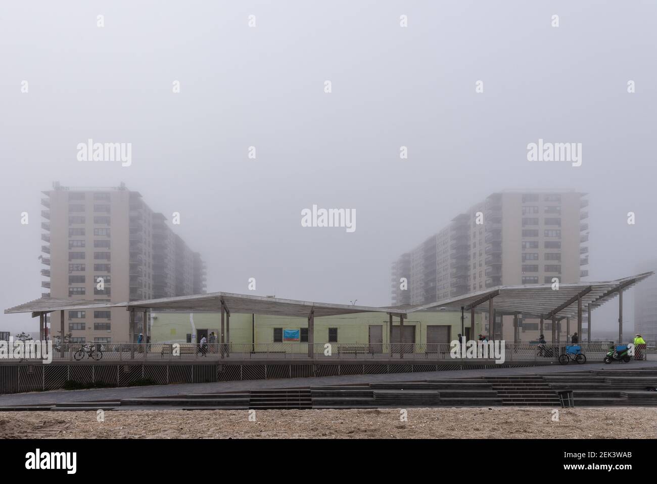 Buildings are barely visible as dense fog is rolling into the Rockaways ...