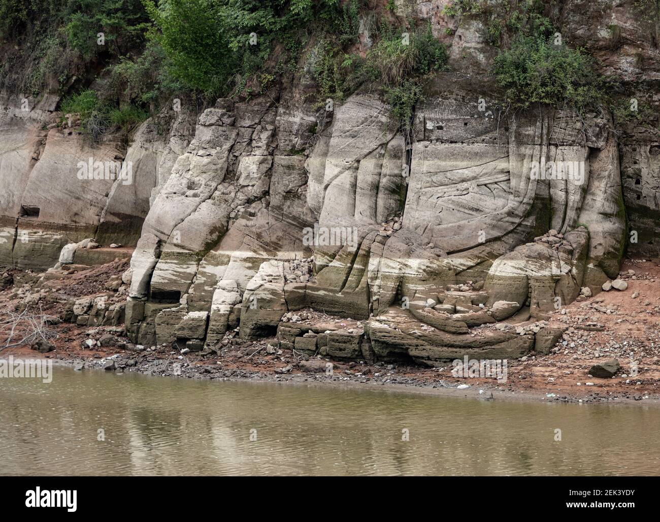 View of the Tang-dynasty sitting buddha sculptures exposed from a water ...
