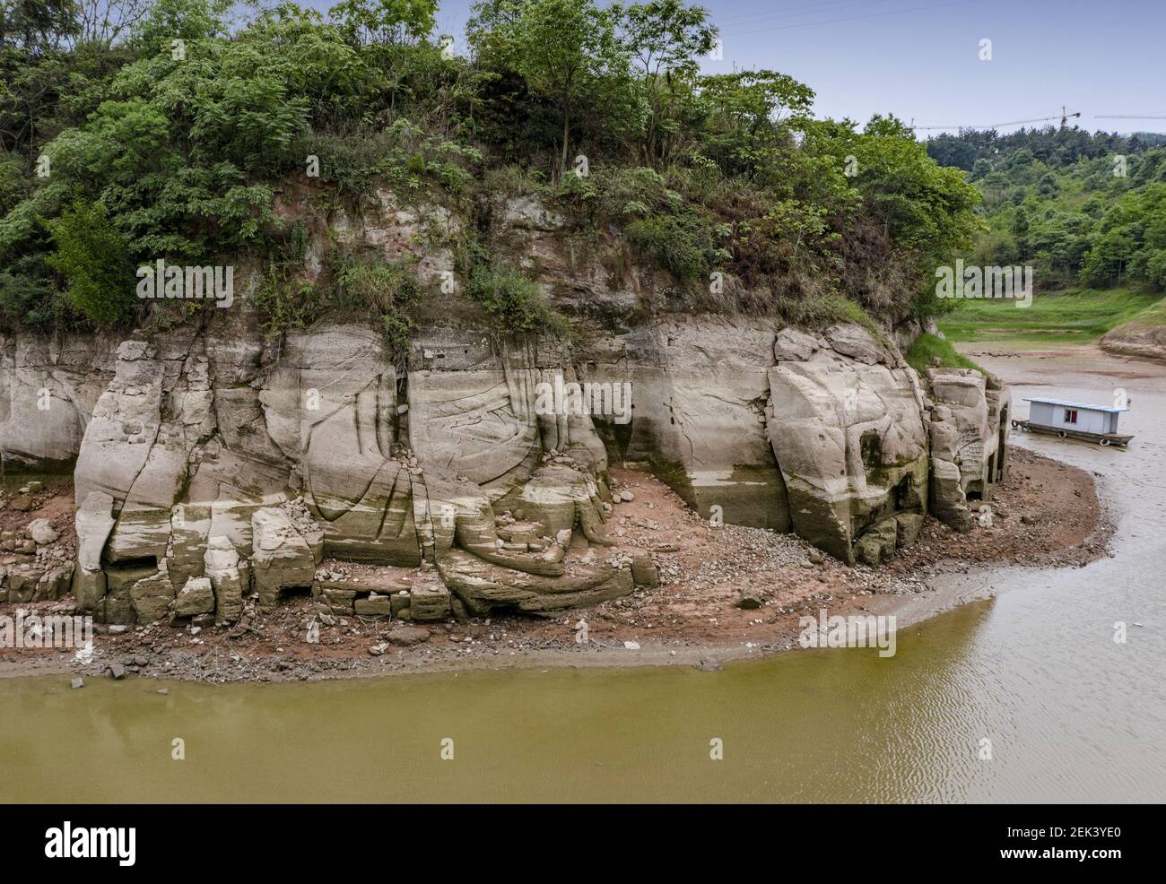 View of the Tang-dynasty sitting buddha sculptures exposed from a water ...