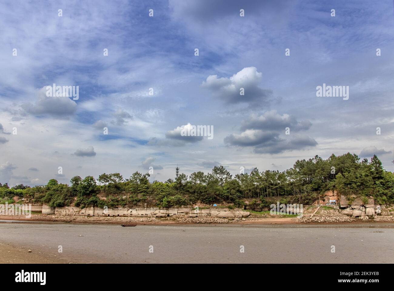 View of the Tang-dynasty sitting buddha sculptures exposed from a water ...