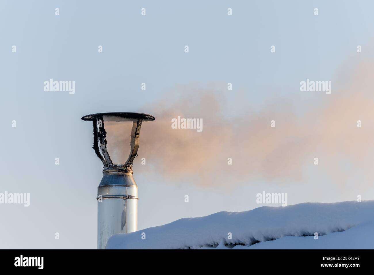 Smoke coming out of the house chimney. CO2 pollution Stock Photo - Alamy