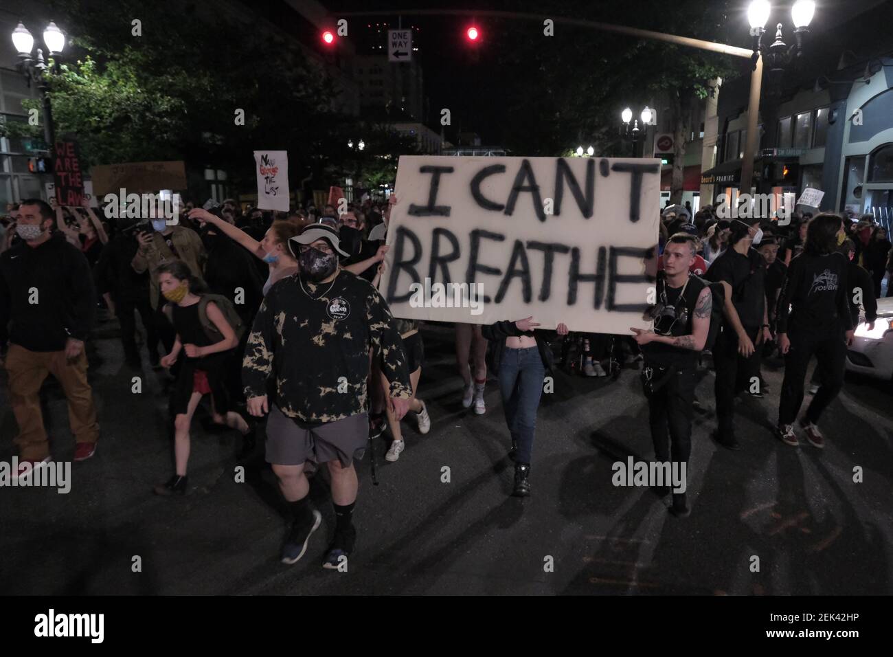 Protesters march through the streets of Portland, Ore., on May 29, 2020 ...