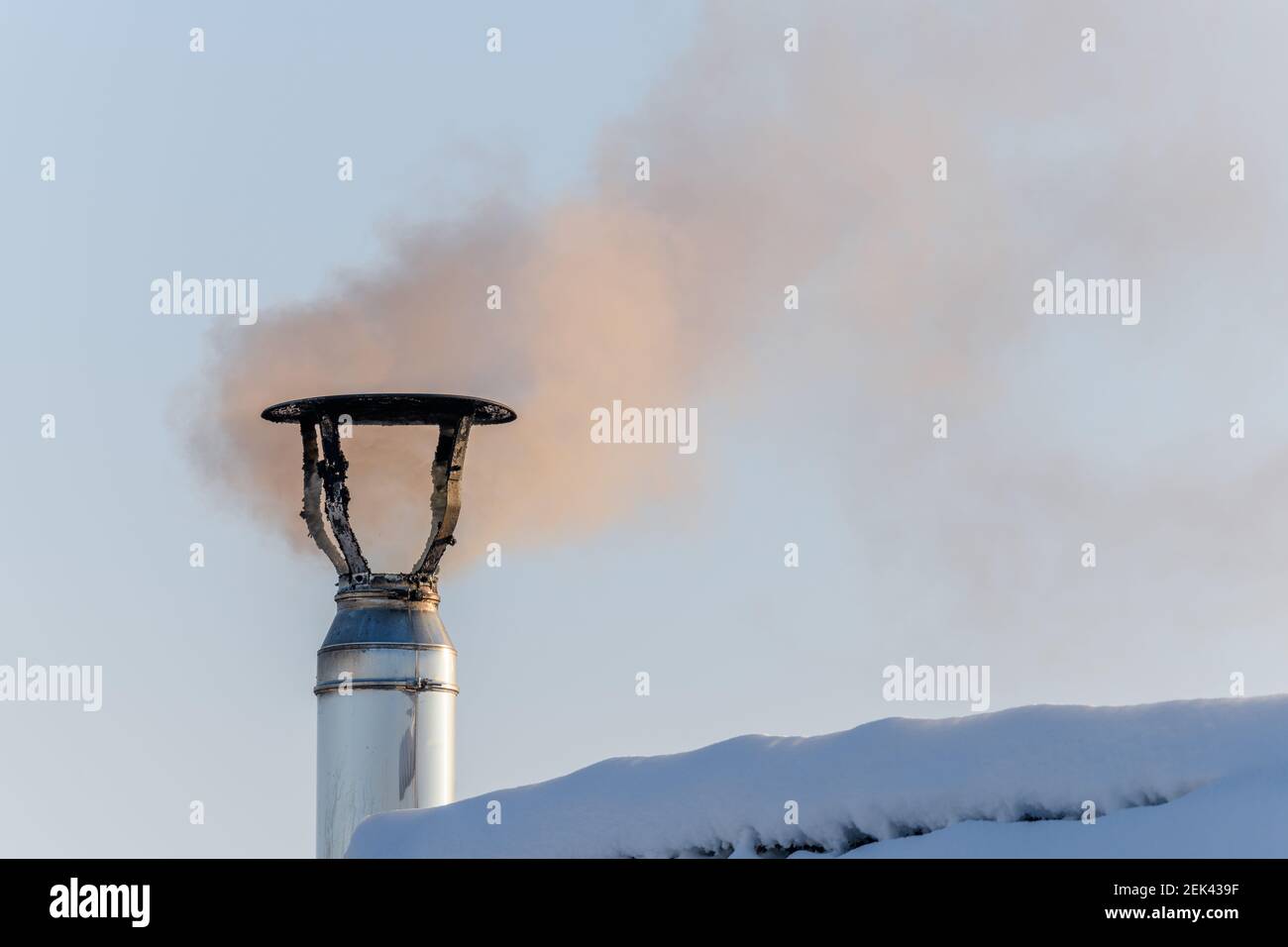 Smoke coming out of the house chimney. CO2 pollution Stock Photo - Alamy