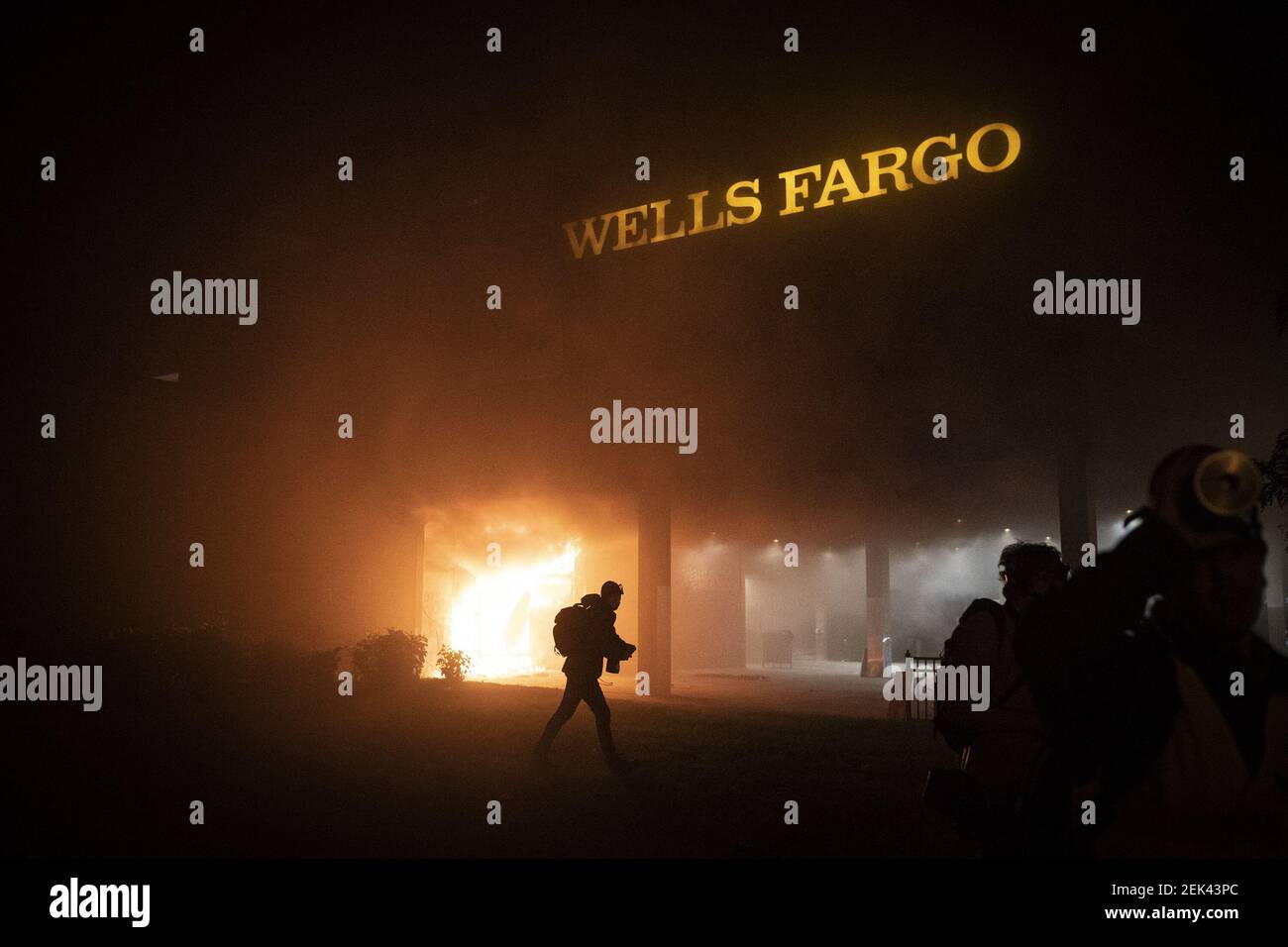 Smoke billows from a fire at the Wells Fargo near the Fifth Precinct in ...