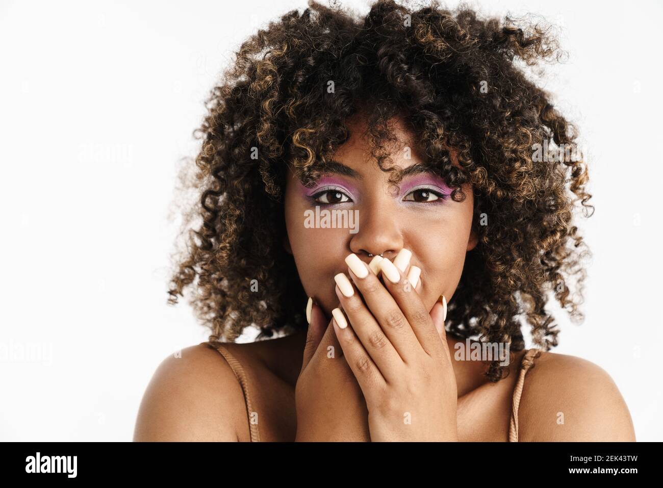 Nice african american girl with piercing covering her mouth isolated ...