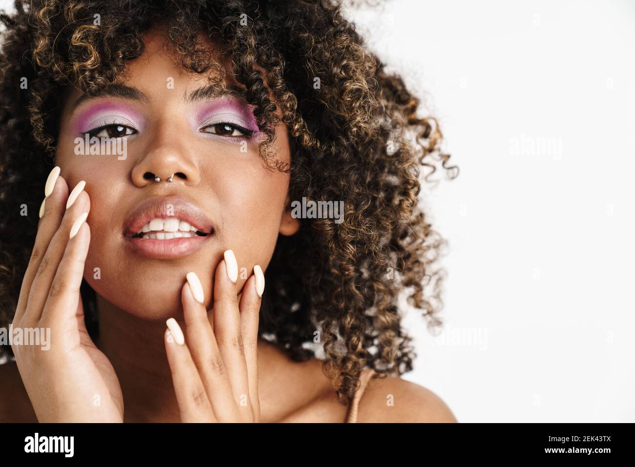 Beautiful African American Girl With Piercing Touching Her Face
