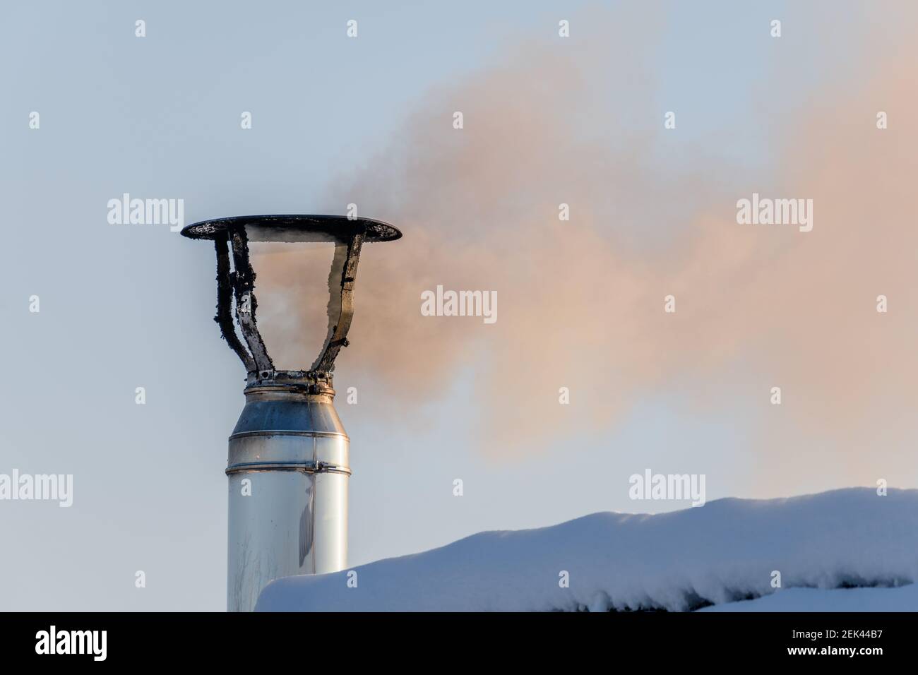 Smoke coming out of the house chimney. CO2 pollution Stock Photo - Alamy