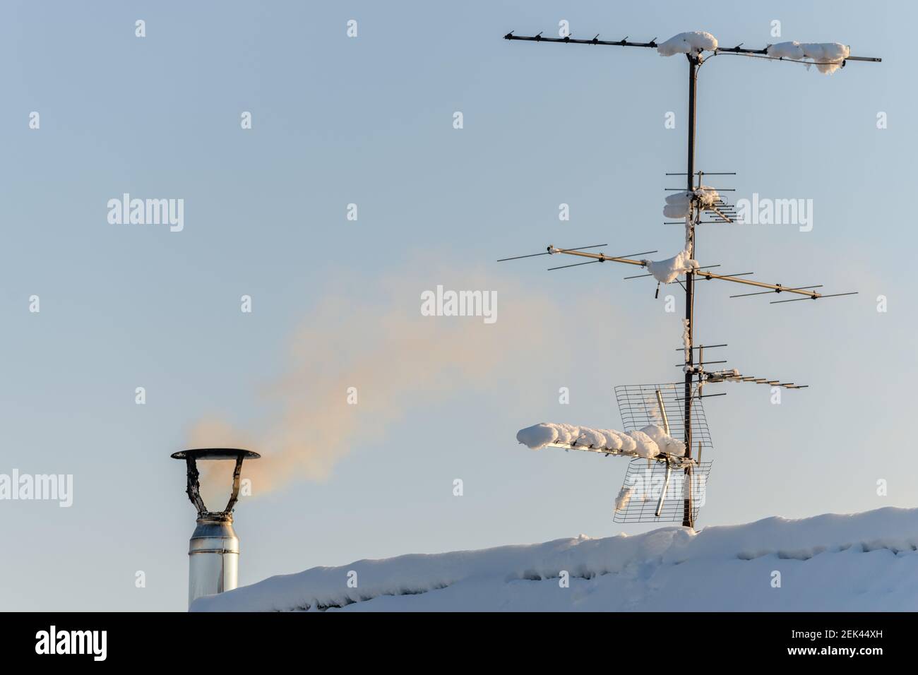 Smoke coming out of the house chimney. CO2 pollution Stock Photo - Alamy