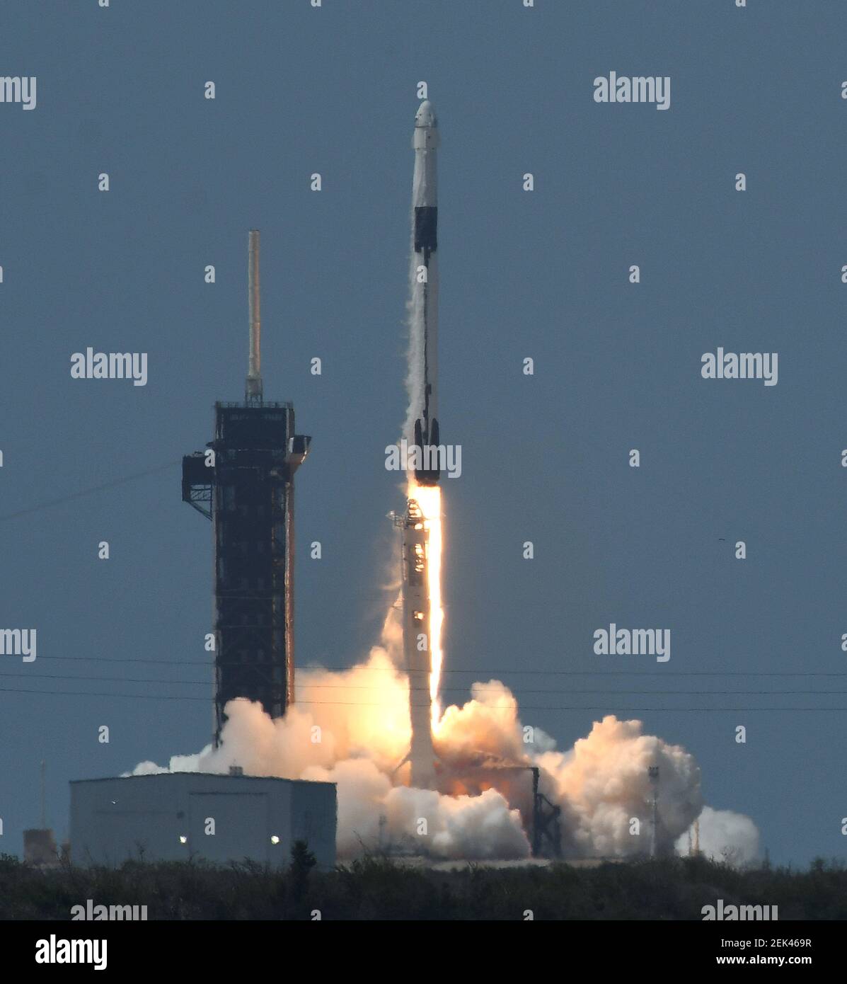 A SpaceX Falcon 9 rocket with the Crew Dragon spacecraft launches ...