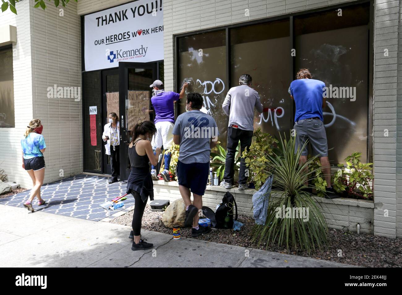 Volunteers pitch in to remove graffiti and clean up glass and debri ...