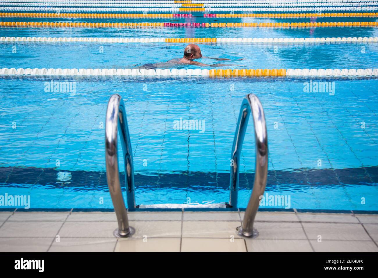 A man seen swimming as water parks reopen. Swimming pools reopened ...