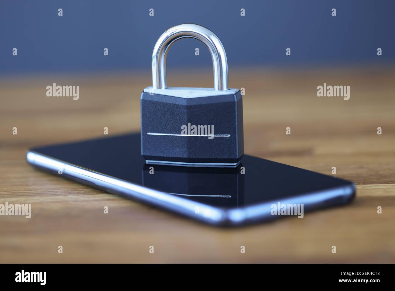 Smartphone with lock on screen is on table Stock Photo - Alamy
