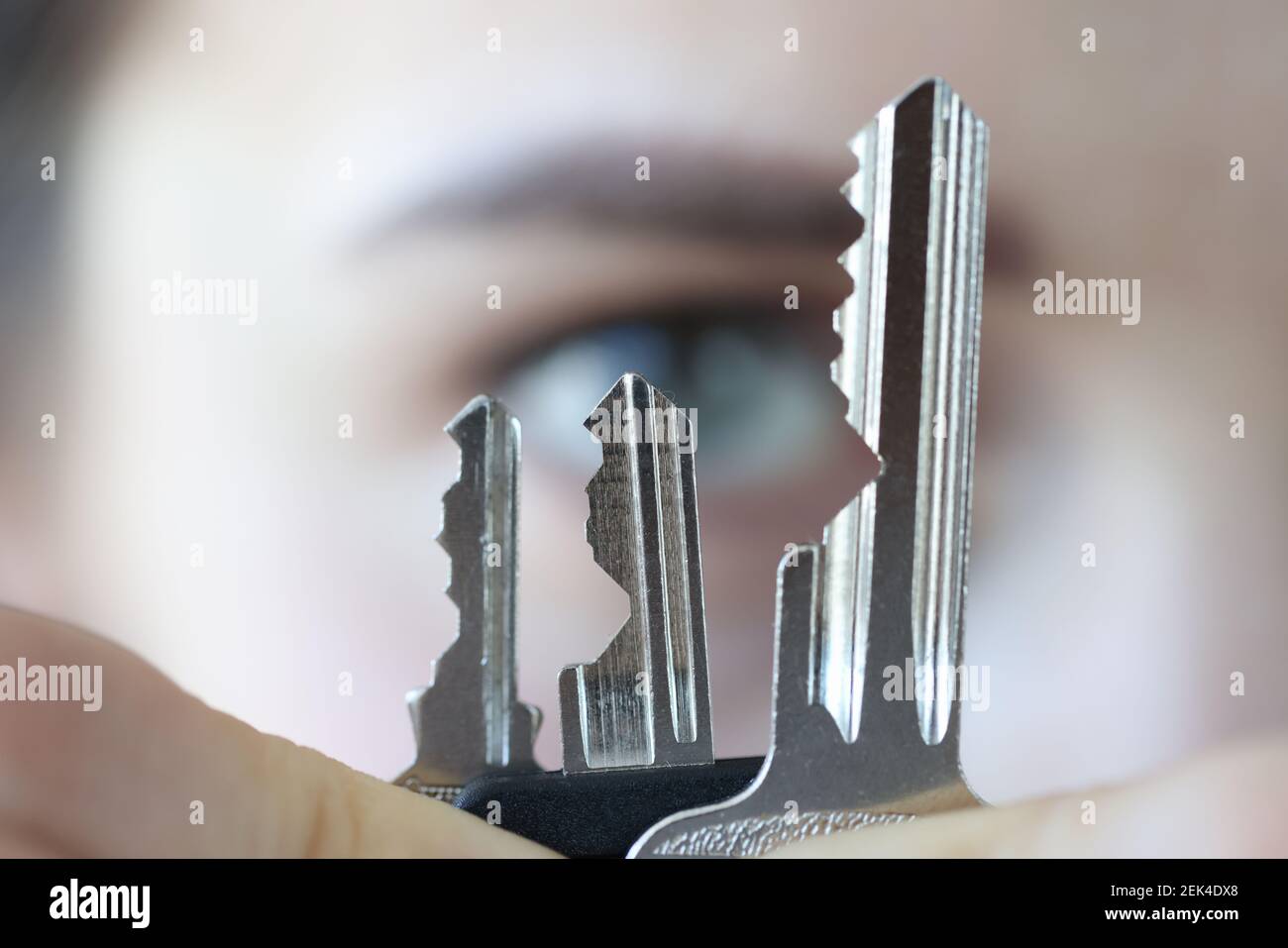 Human holds three different keys in his hand Stock Photo - Alamy