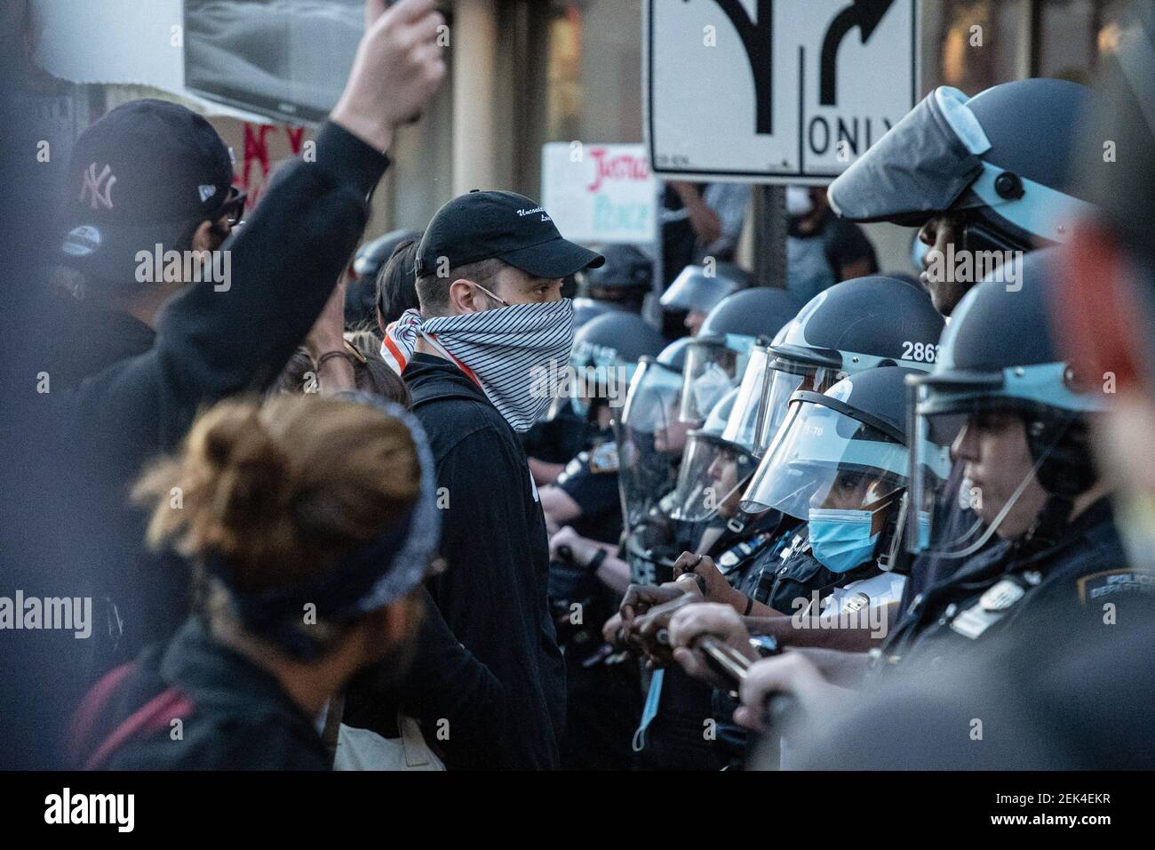 A protester and police stare-down as an anti police brutality march ...