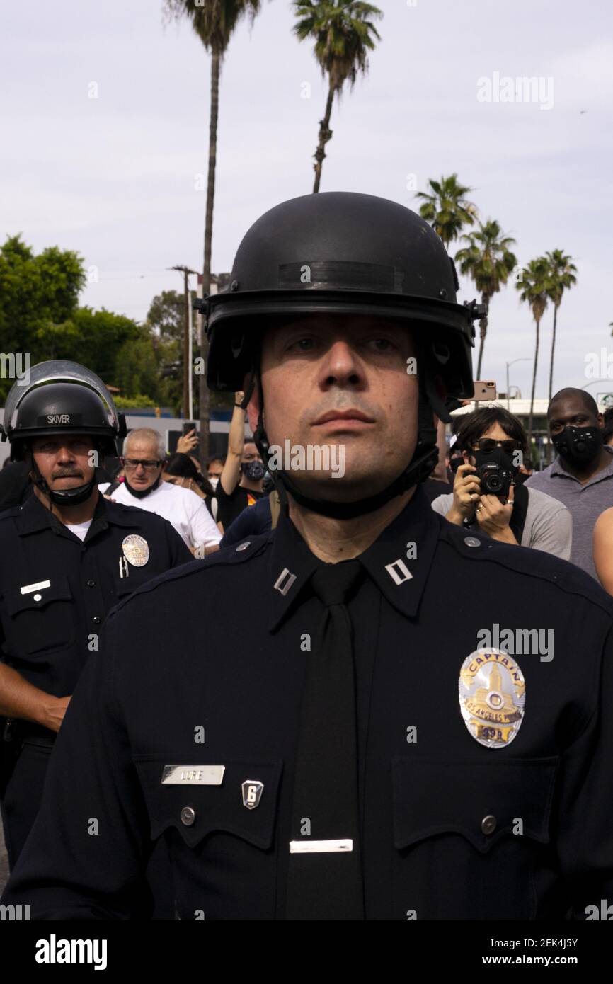 Hollywood: An officer stood at attention next to LAPD Commander Cory ...