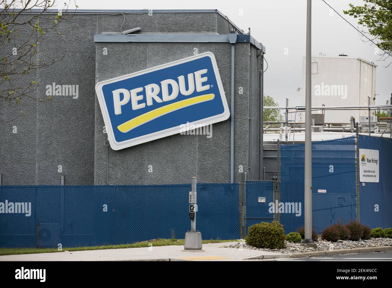 A logo sign outside of a Perdue Farms poultry processing plant in ...