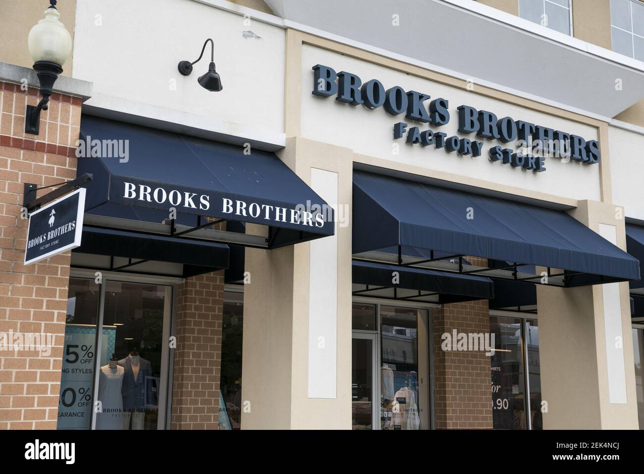 A logo sign outside of a Brooks Brothers Factory retail store in ...