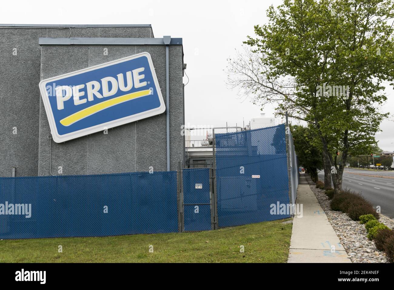 A logo sign outside of a Perdue Farms poultry processing plant in ...