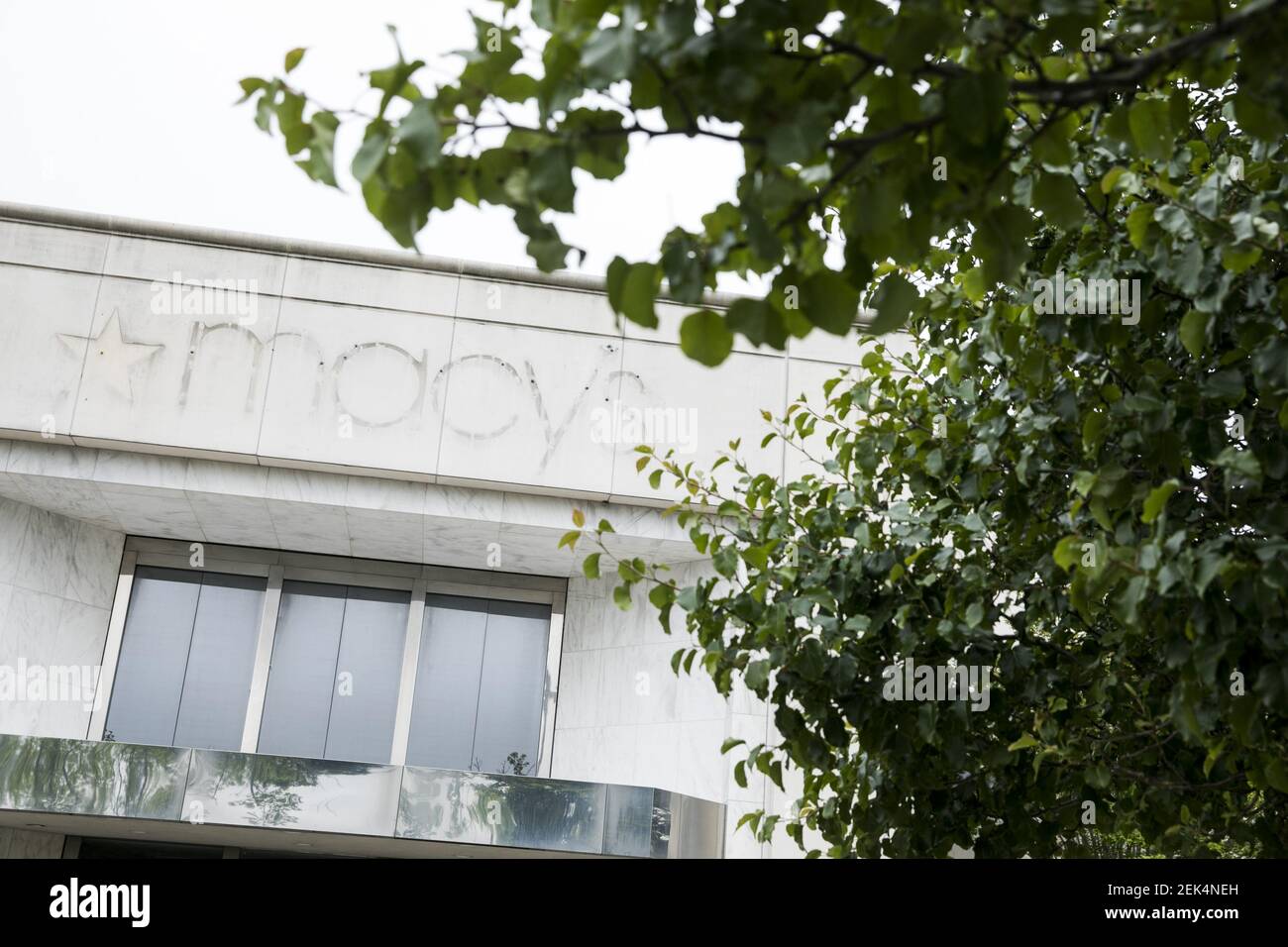 The faded outline of a logo sign outside of a closed and abandoned ...